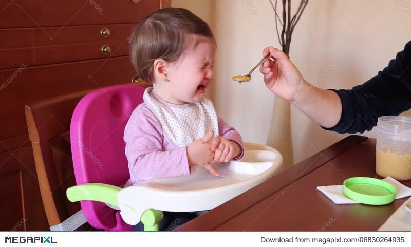 Baby Girl Crying Spoon Food Stock Video Footage by Megapixl
