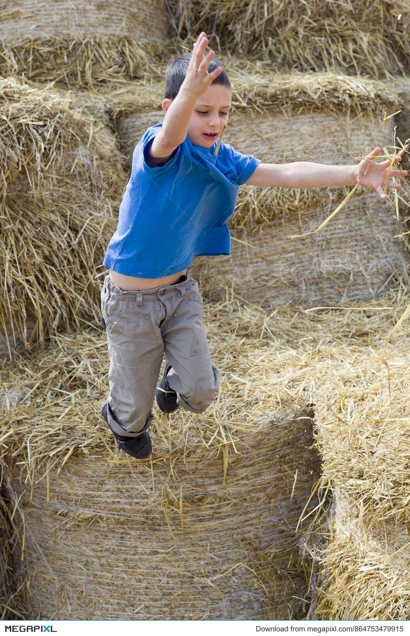 Child Jumping Haystack Stock Images by Megapixl